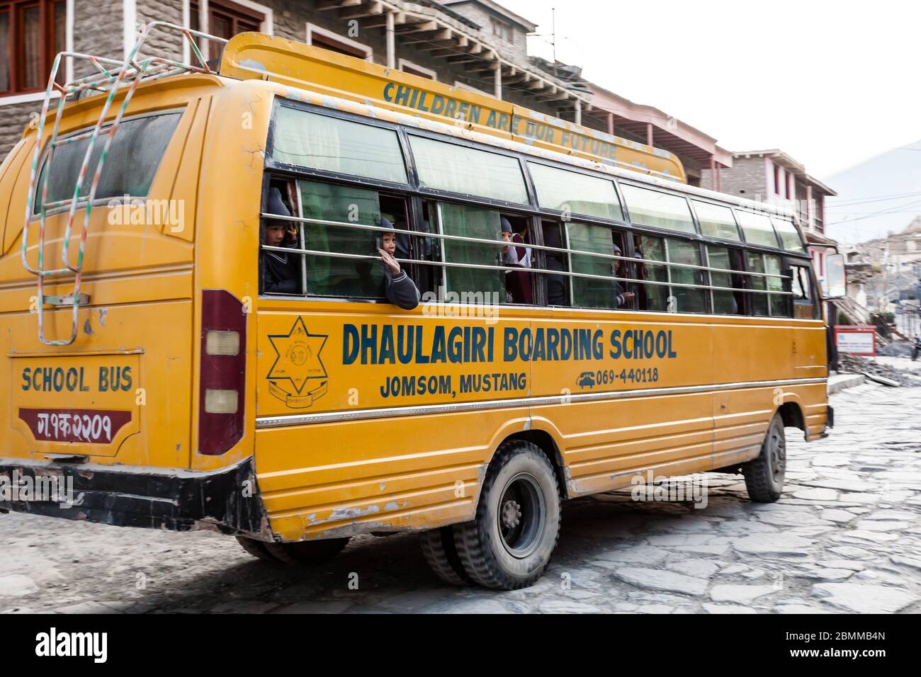 Jomsom, Nepal - November 19, 2015: Children riding a school bus to ...