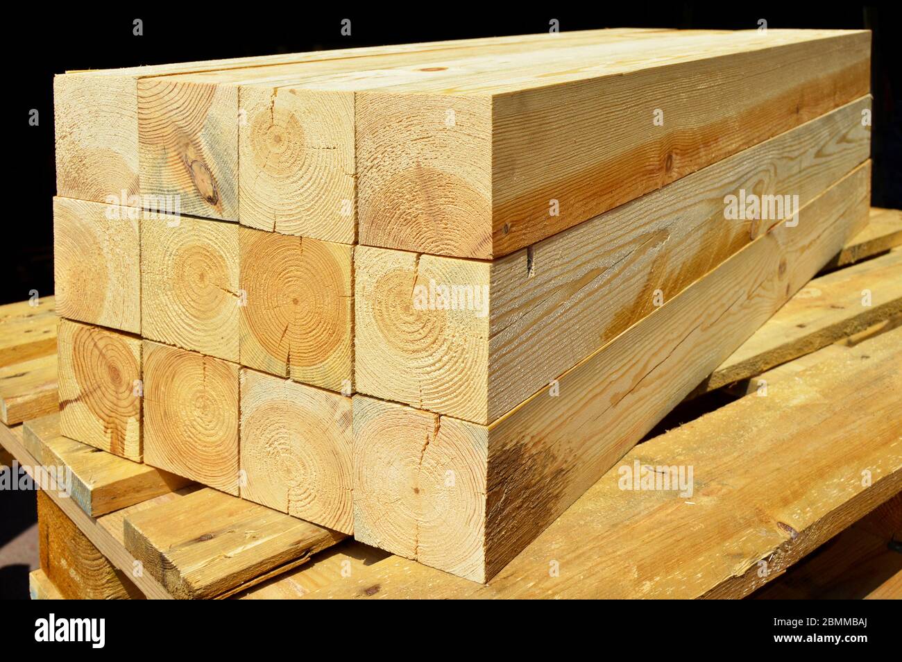 Pine lumber stacked in a row at the sawmill, lumber stack for storage ...