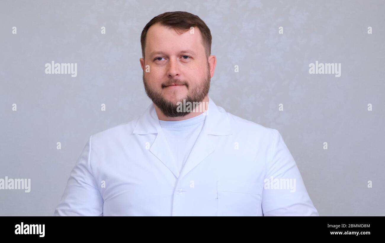 Portrait of a bearded male doctor intern with a slight smile Stock ...