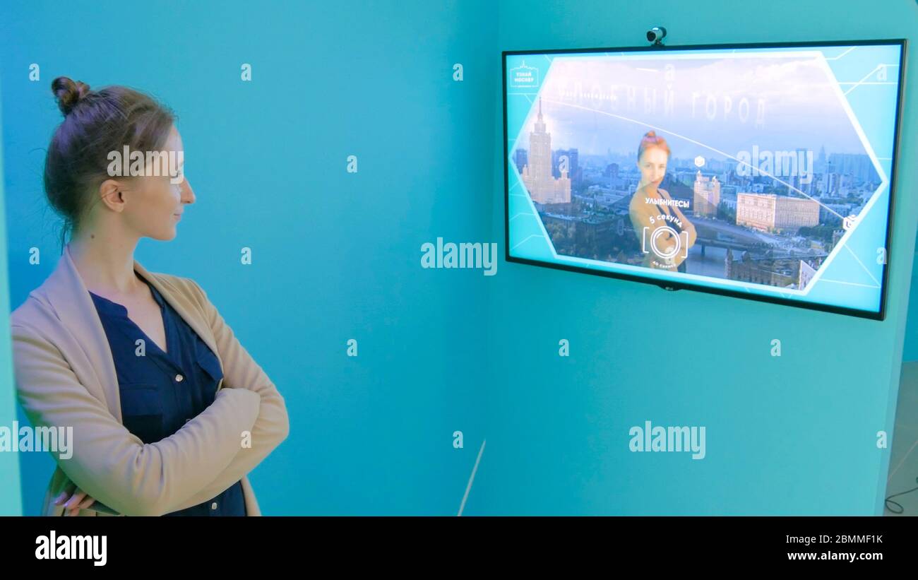 MOSCOW, RUSSIA - July 30, 2018: Smart City Exhibition. Woman taking ...