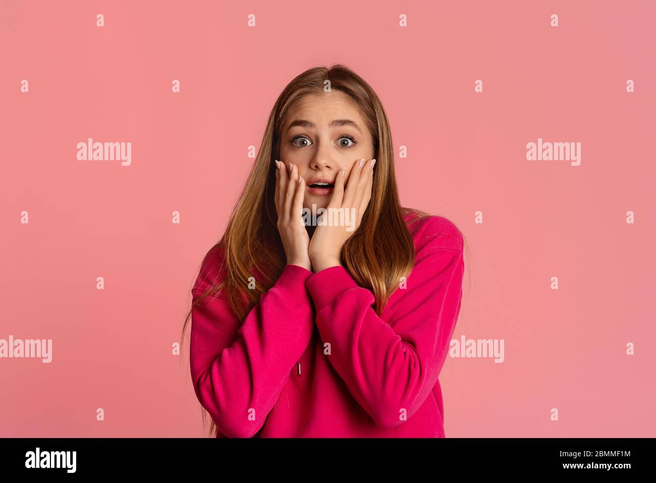 Scared girl covers her face with hands Stock Photo - Alamy
