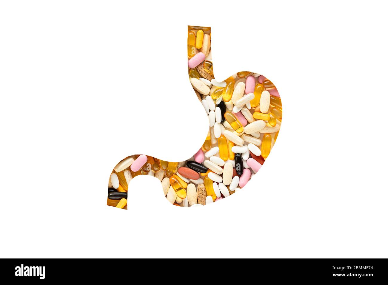 Shape of Stomach cut from paper with pills, on white background ...