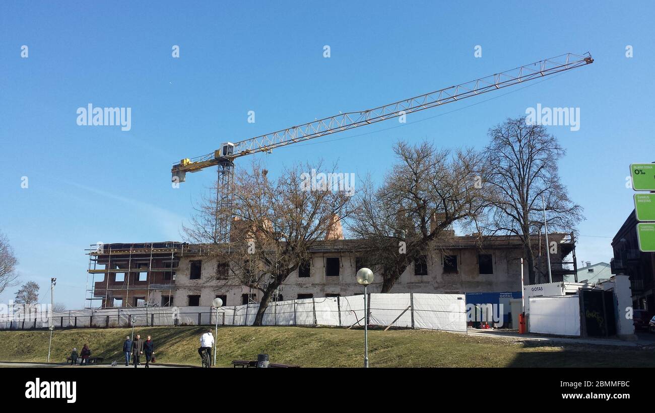 Construction site on the hill with long crane Stock Photo - Alamy