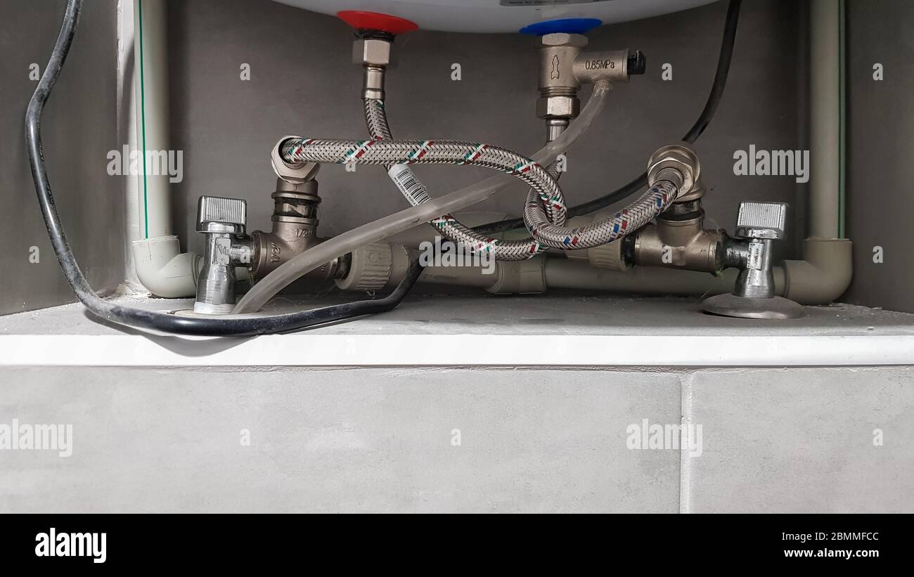 Connection of water supply, hot and cold water to the boiler. Hose for ...