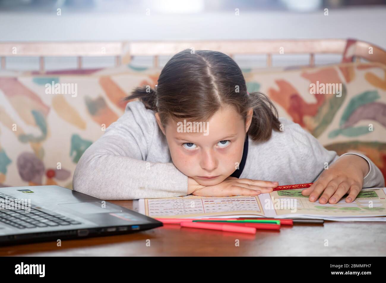 Distance learning-online education. School girl watching online ...