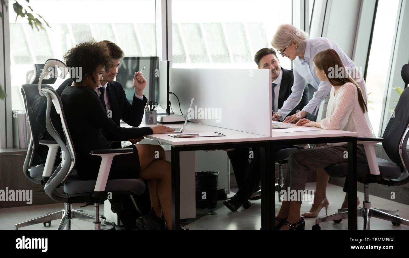 Busy multiracial employees working in co-working open space Stock Photo ...