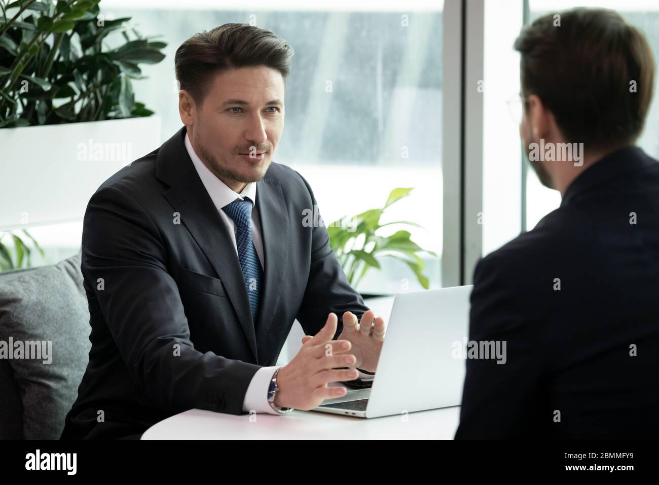 Client and bank manager negotiating about loan lending possibility ...