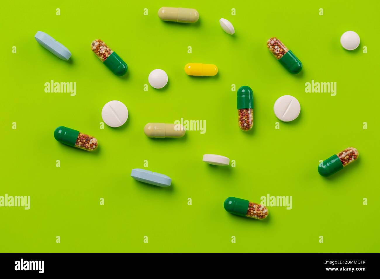Different medications. Various pill and capsules. One-color backdrop ...