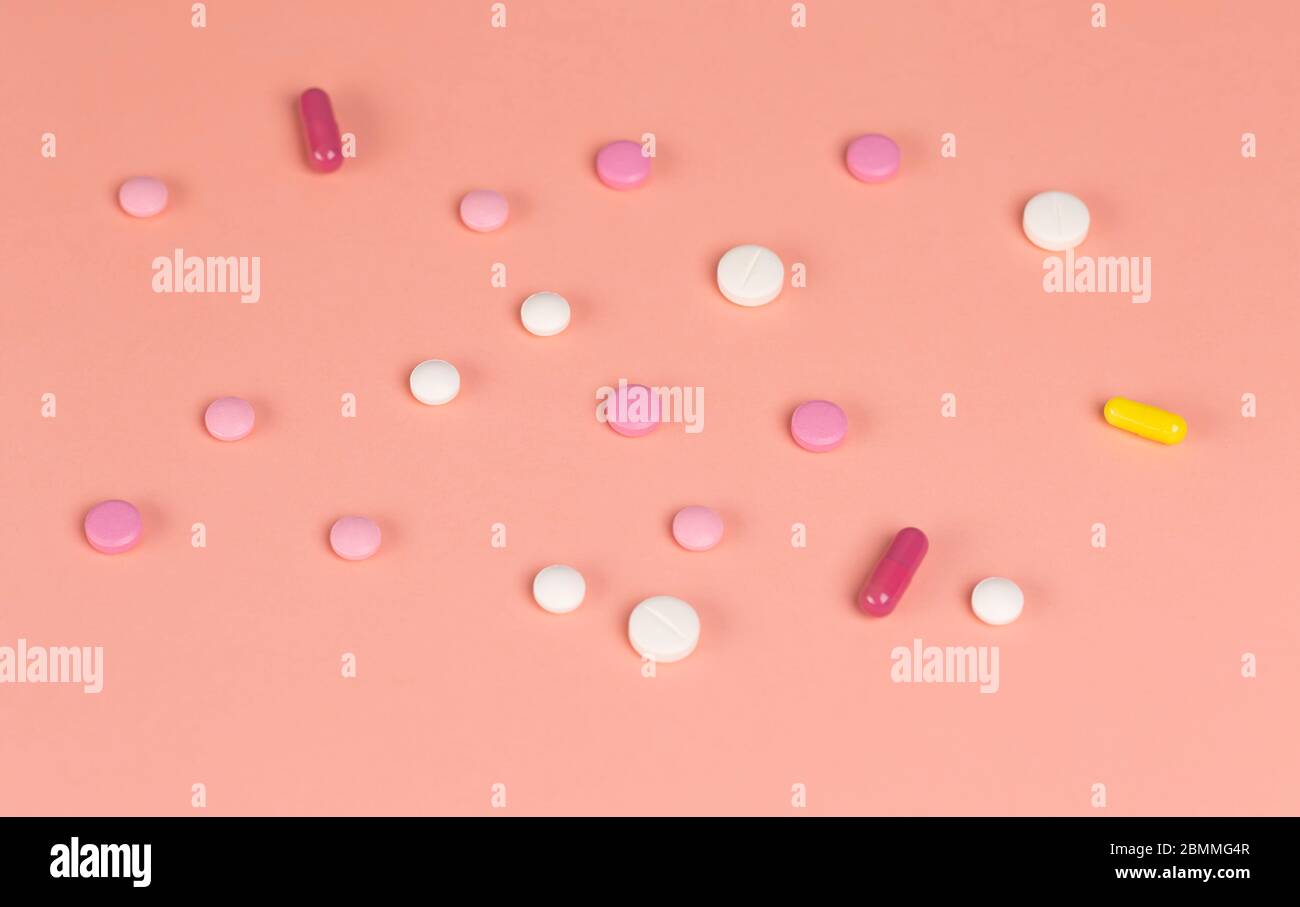 Different medications. Various pills and capsules. One-color backdrop ...