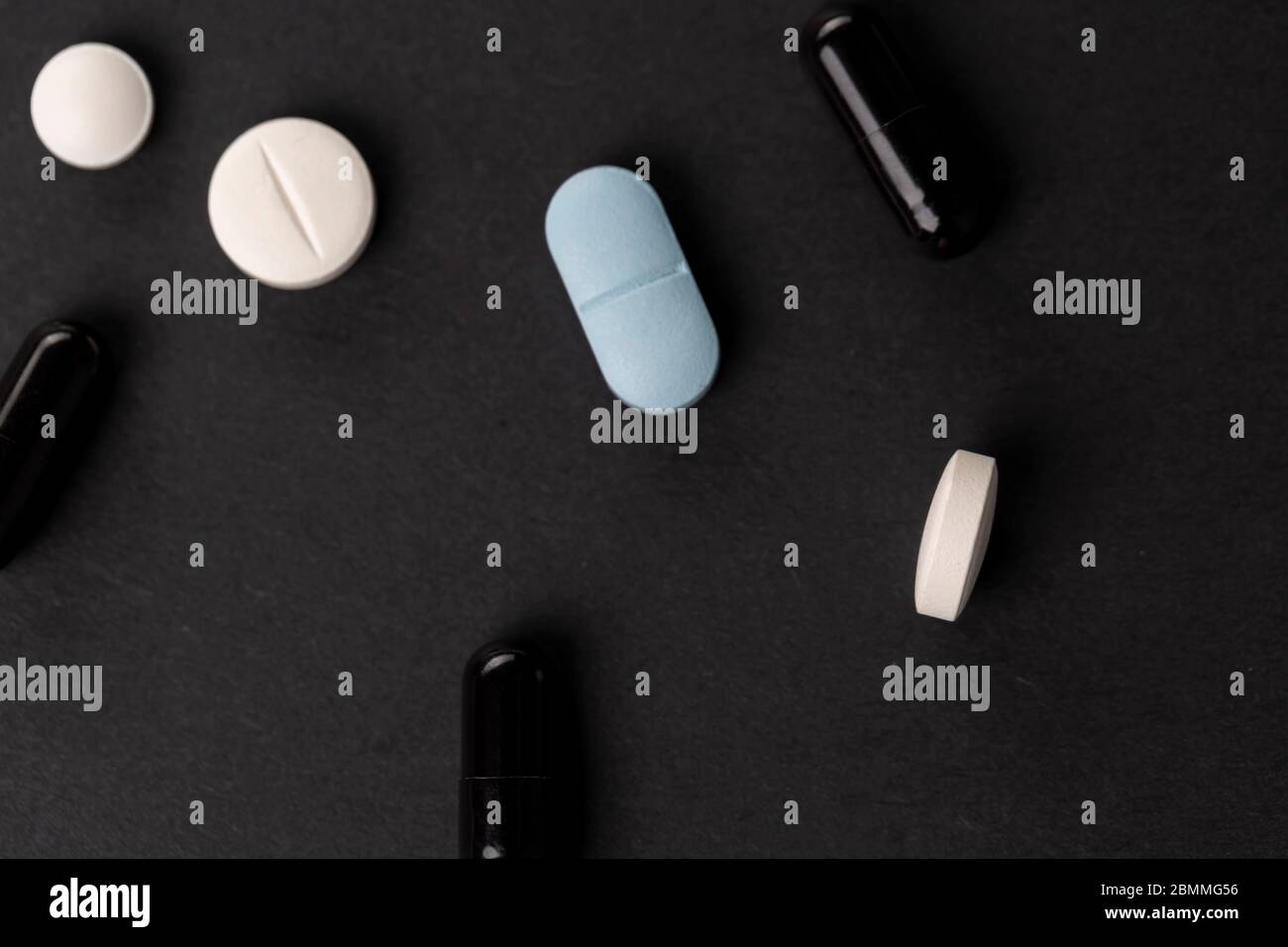 Different medications. Various pill and capsules. One-color backdrop ...