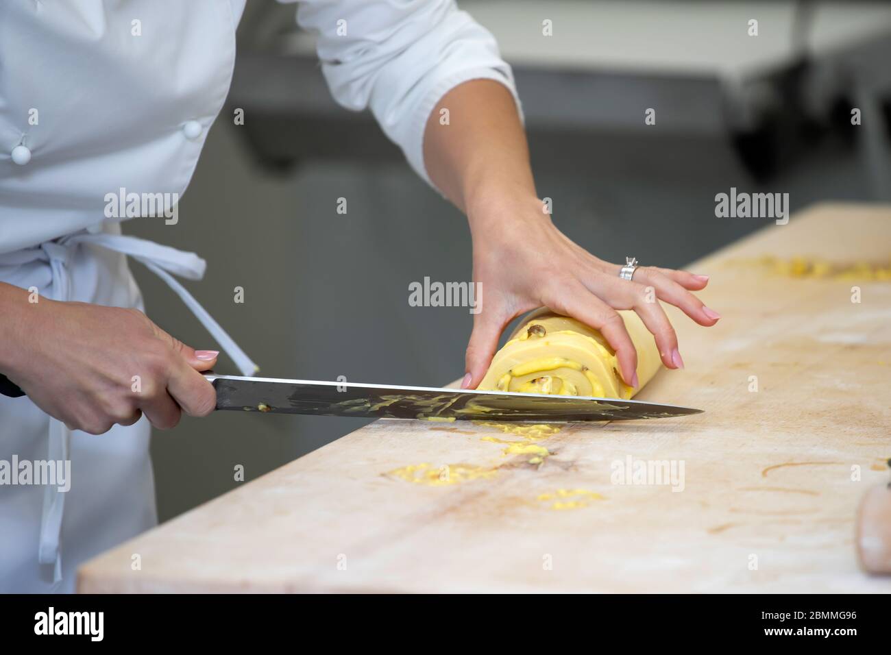 Baker working in bakery making tradition french bread and pastry Stock ...