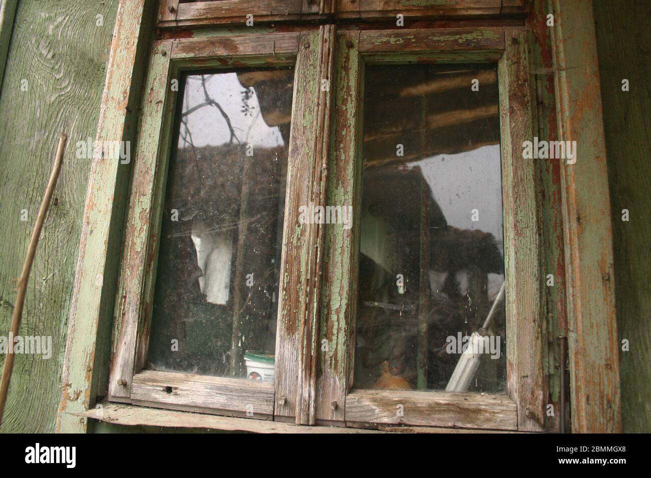 Distressed window of an unkempt old house in Romania's countryside ...