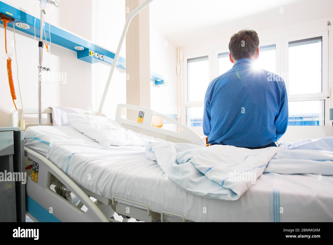 Senior male patient in a modern hospital. Getting better after a ...