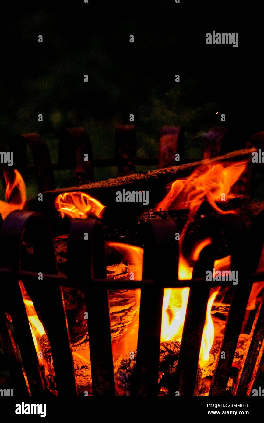 Red Hot Fire Pit Basket With Flames at Night Time Stock Photo - Alamy