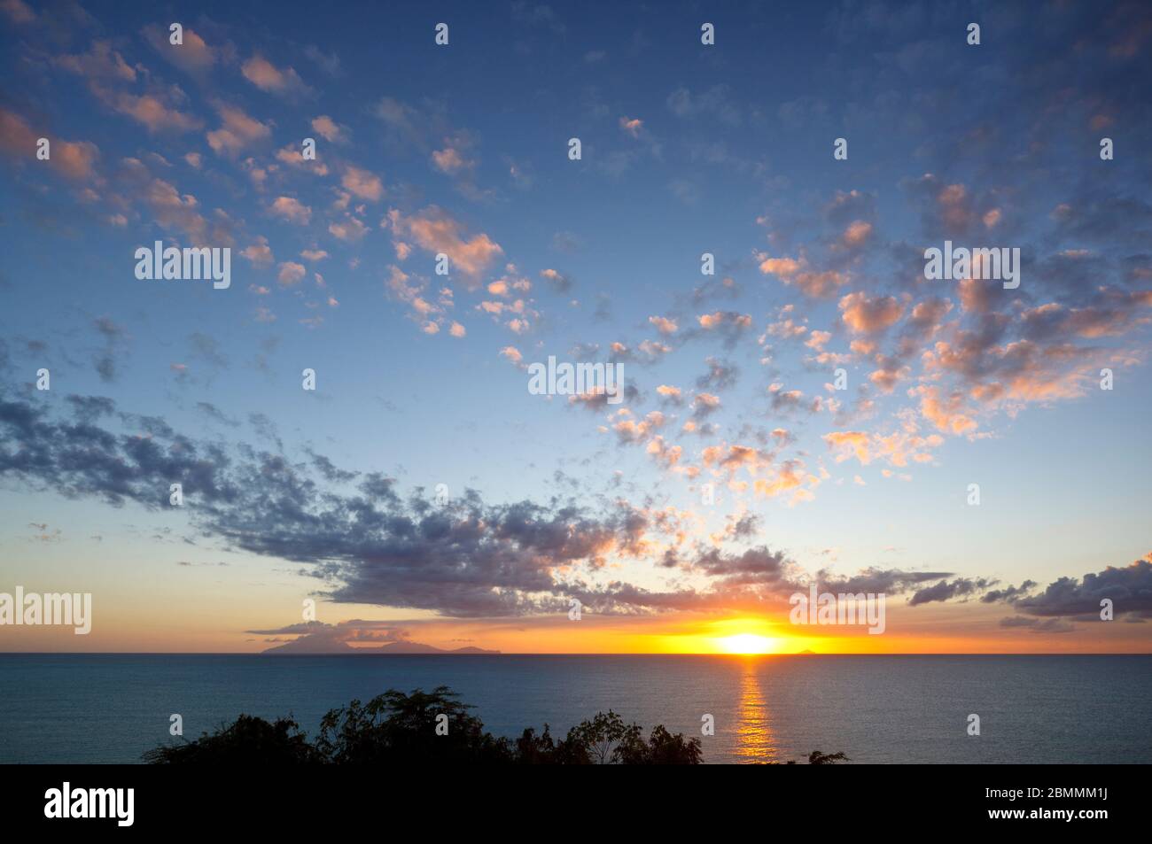 Caribbean sunset near Montserrat seen from Antigua Stock Photo - Alamy