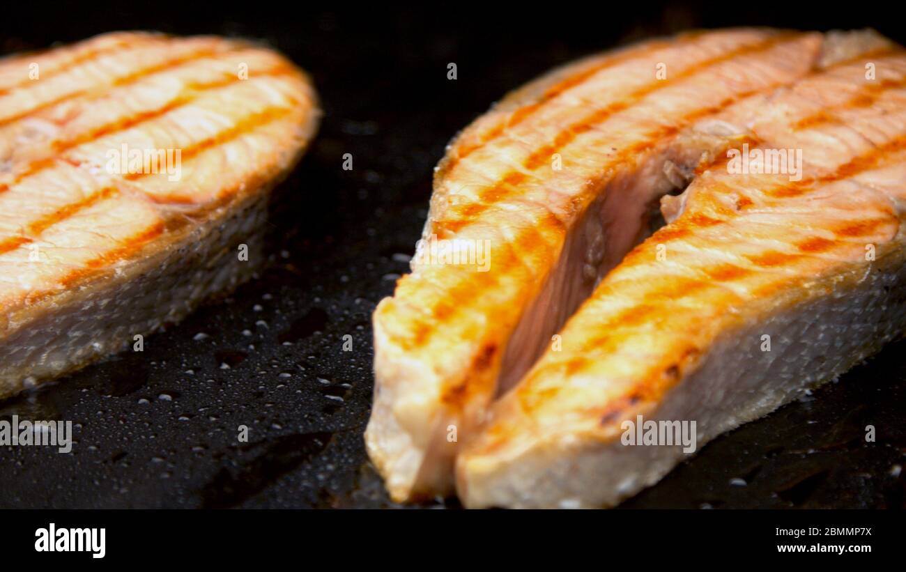 Close-up of of fish cuts being grilled Stock Photo - Alamy