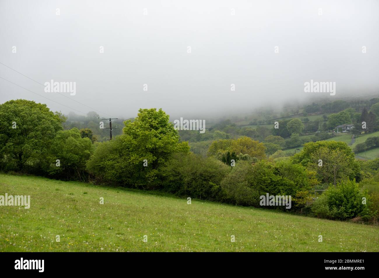 Mist descends from the moor into the valley Stock Photo - Alamy