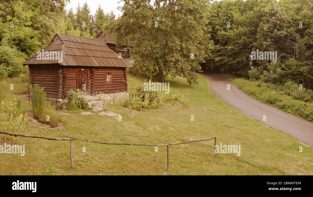 Log small building in the forest Stock Photo - Alamy