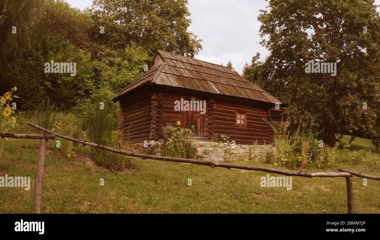Log small building on the brick foundation in the forest Stock Photo ...