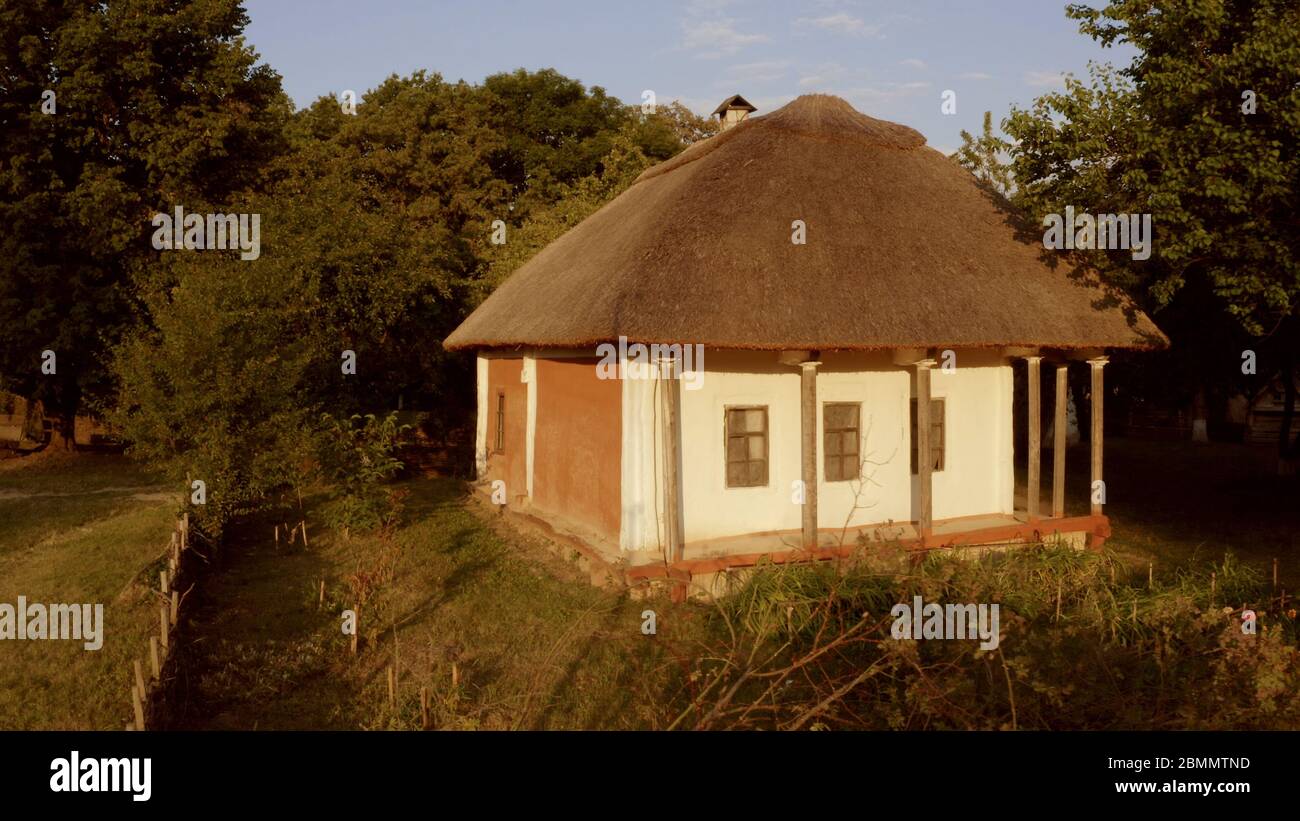 Small house with columns in the village Stock Photo - Alamy
