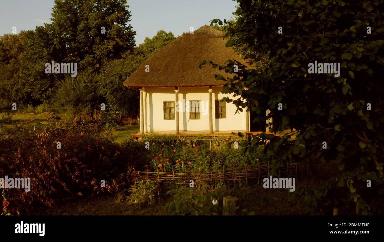 Small rural house with columns in the village Stock Photo - Alamy