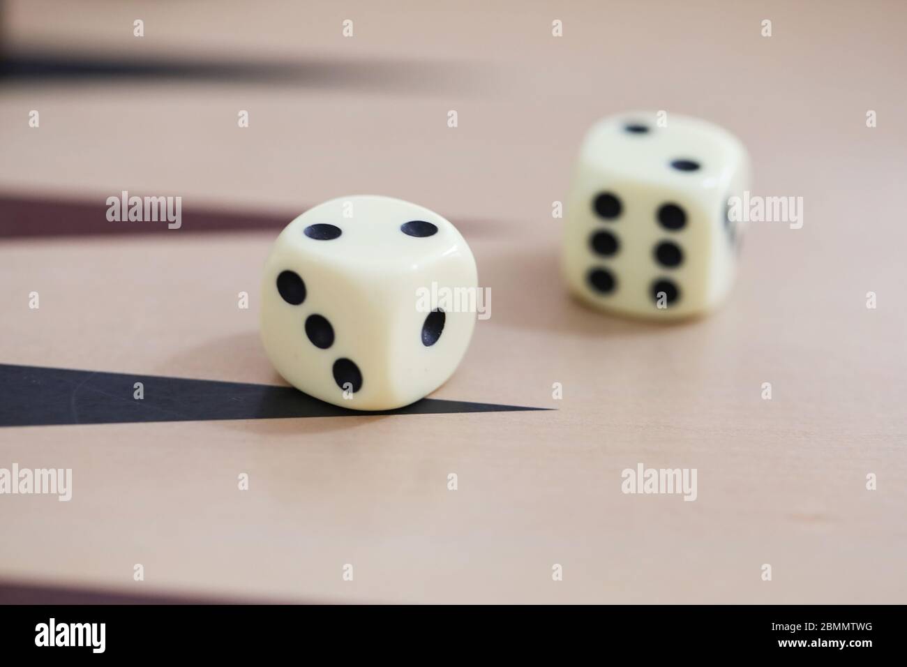 Dice game on backgammon board Stock Photo - Alamy