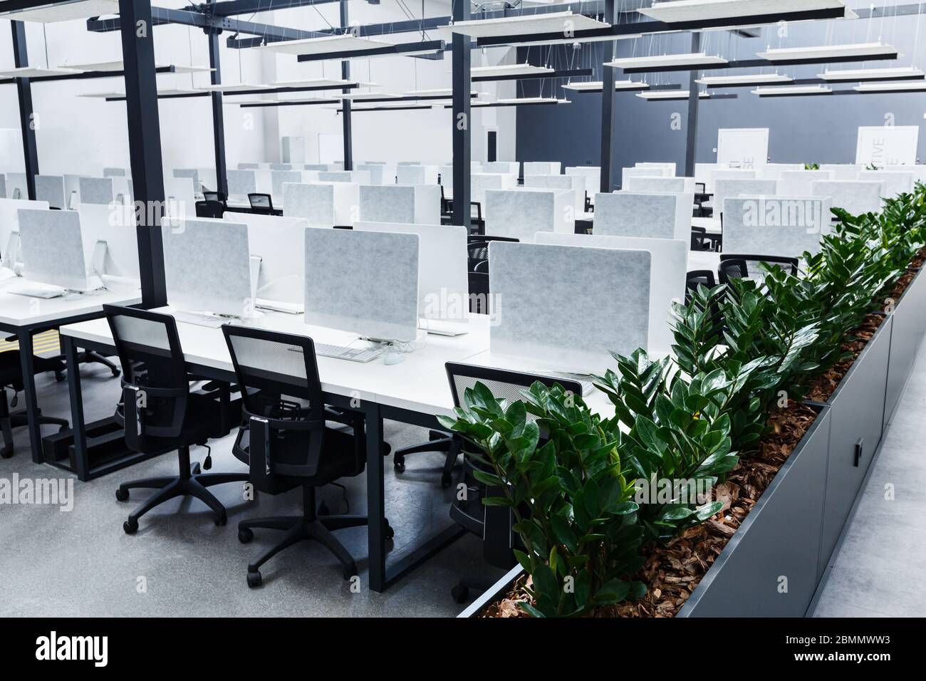 Co-working interior with wrapped computers, no people, quarantine Stock ...