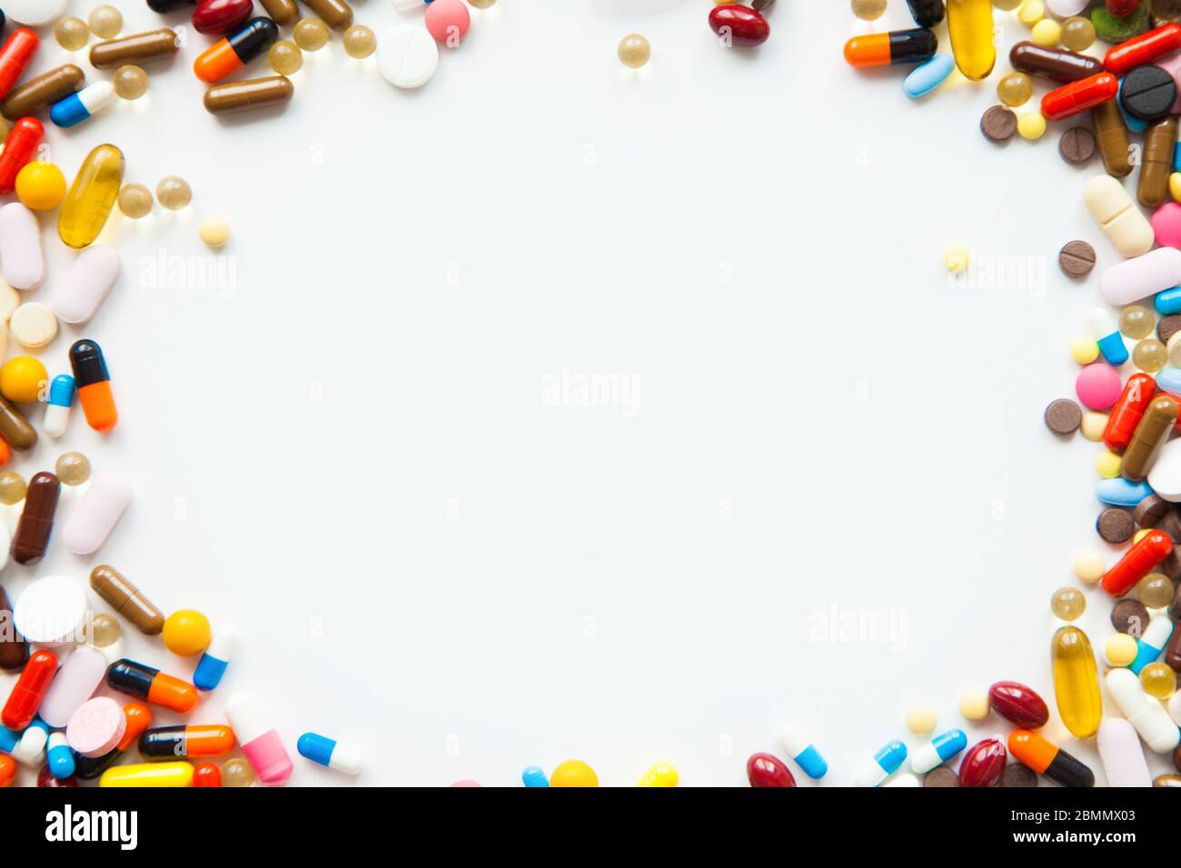Different colorful pills on white background. Circular frame Stock ...