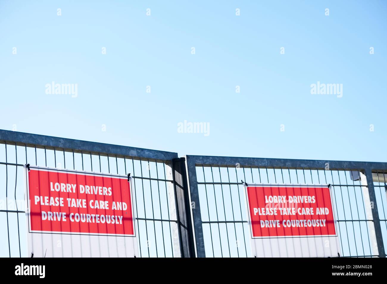 Lorry driver take care and caution sign at construction building site ...