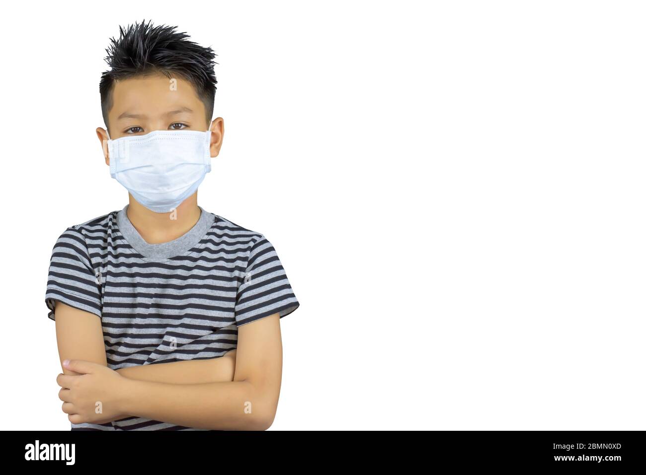 Isolated Asian boy wearing a mask on a white background with clipping ...