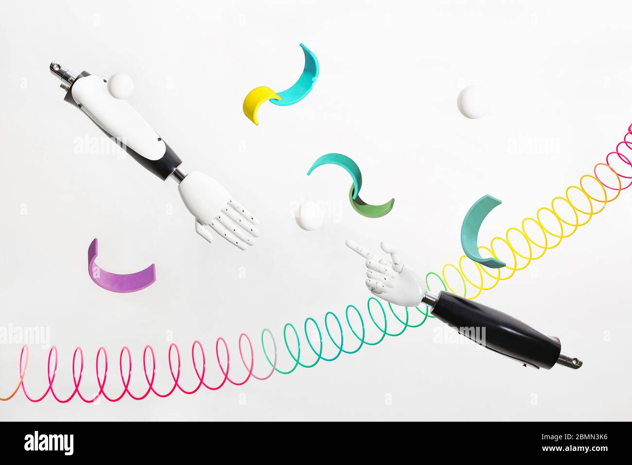 Abstract robot hands with colorful items on white background. Game ...