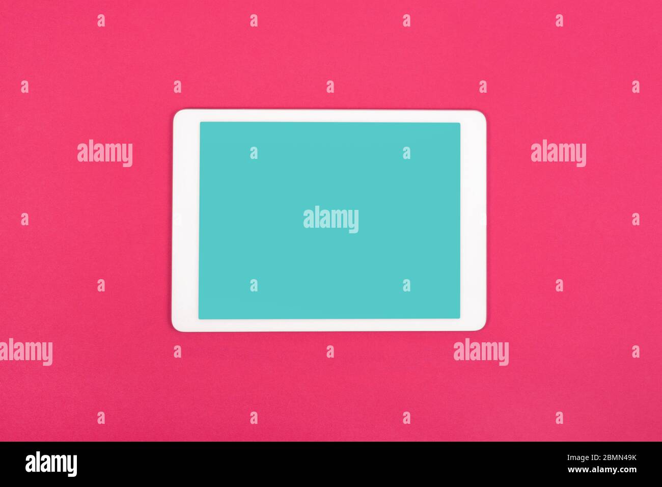 White touchpad with blank screen on red background. Flat lay Stock ...