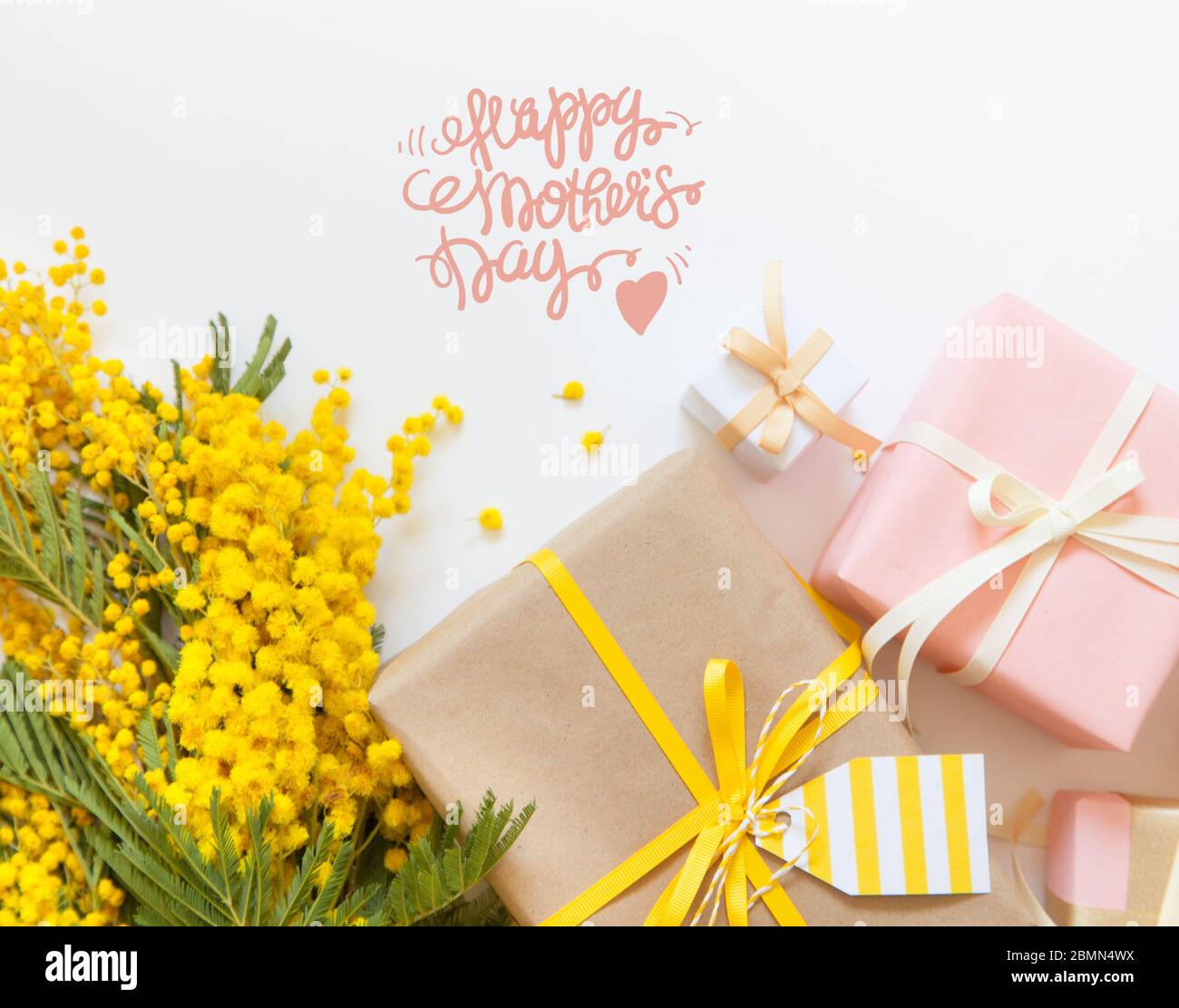 Mimosa flowers and festive gift boxes. Mother's Day and March 8th ...