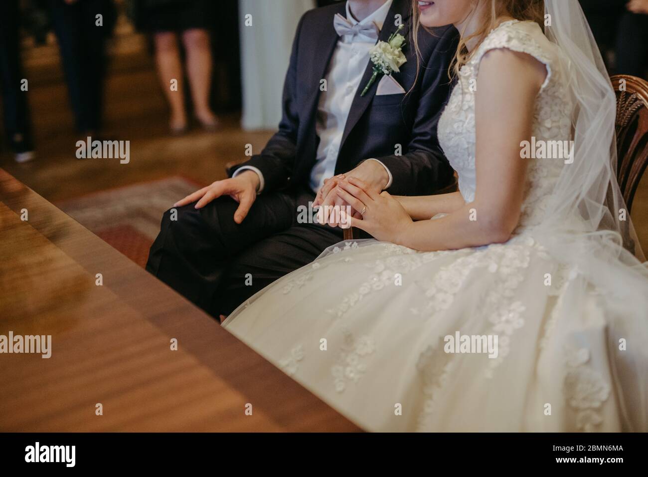 Bride and groom holding hands Stock Photo - Alamy