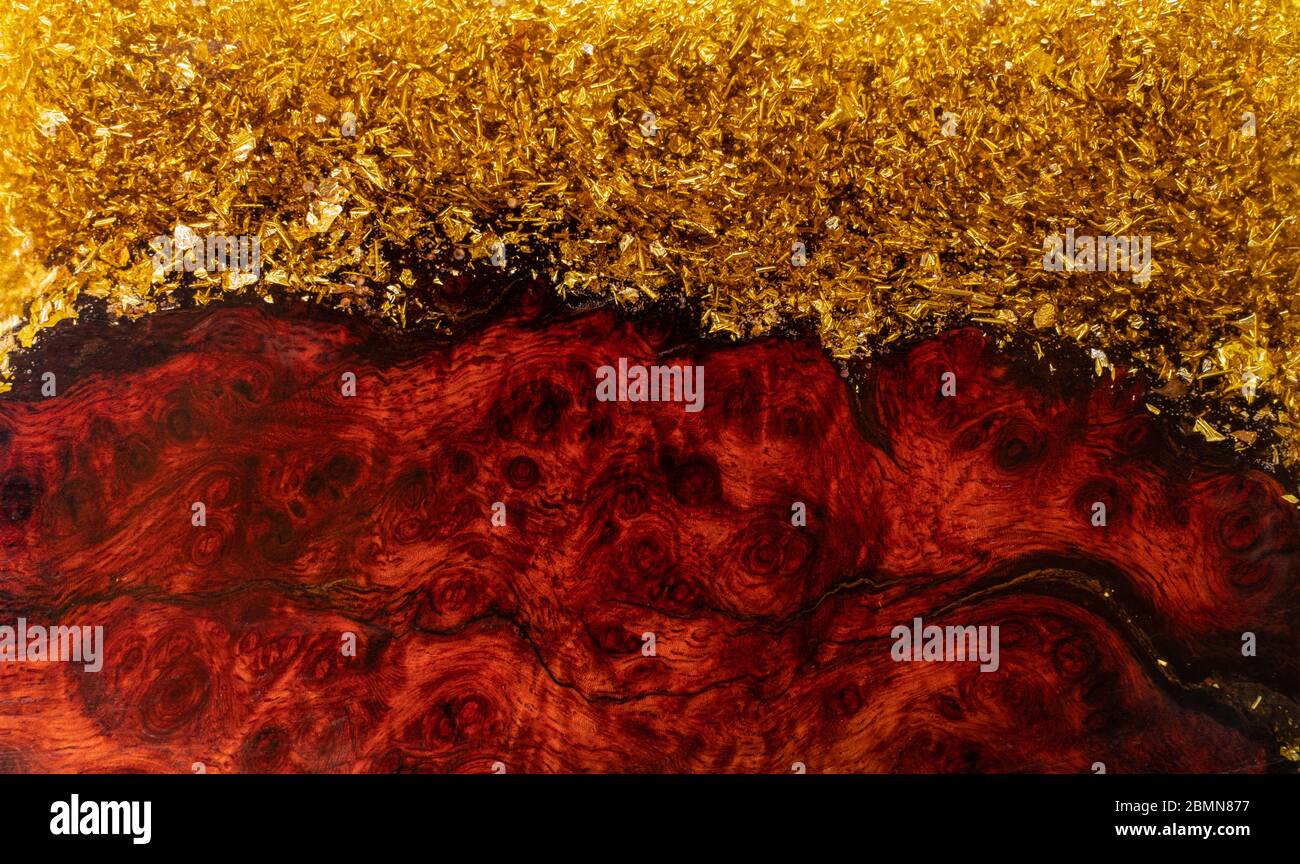 Casting epoxy resin stabilizing Burma padauk wood background texture ...