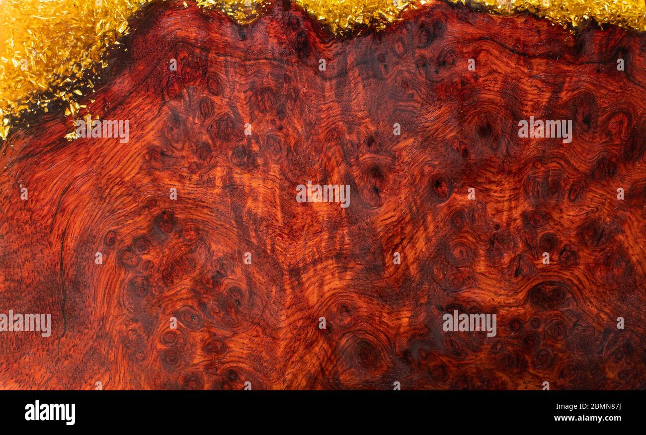 Casting epoxy resin stabilizing Burma padauk wood background texture ...