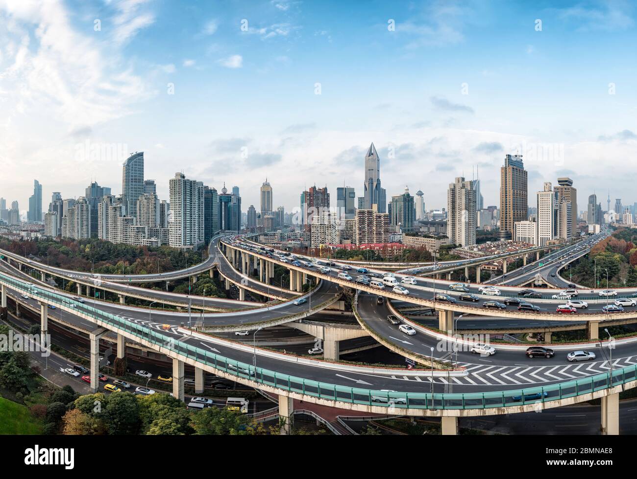 Modern city with highway interchange Stock Photo - Alamy