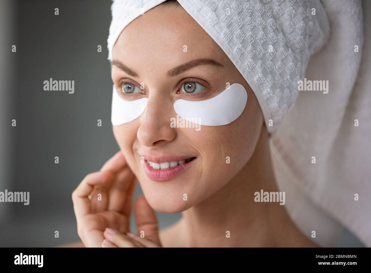 Woman apply anti wrinkle hydrogel eyes patches closeup portrait Stock ...