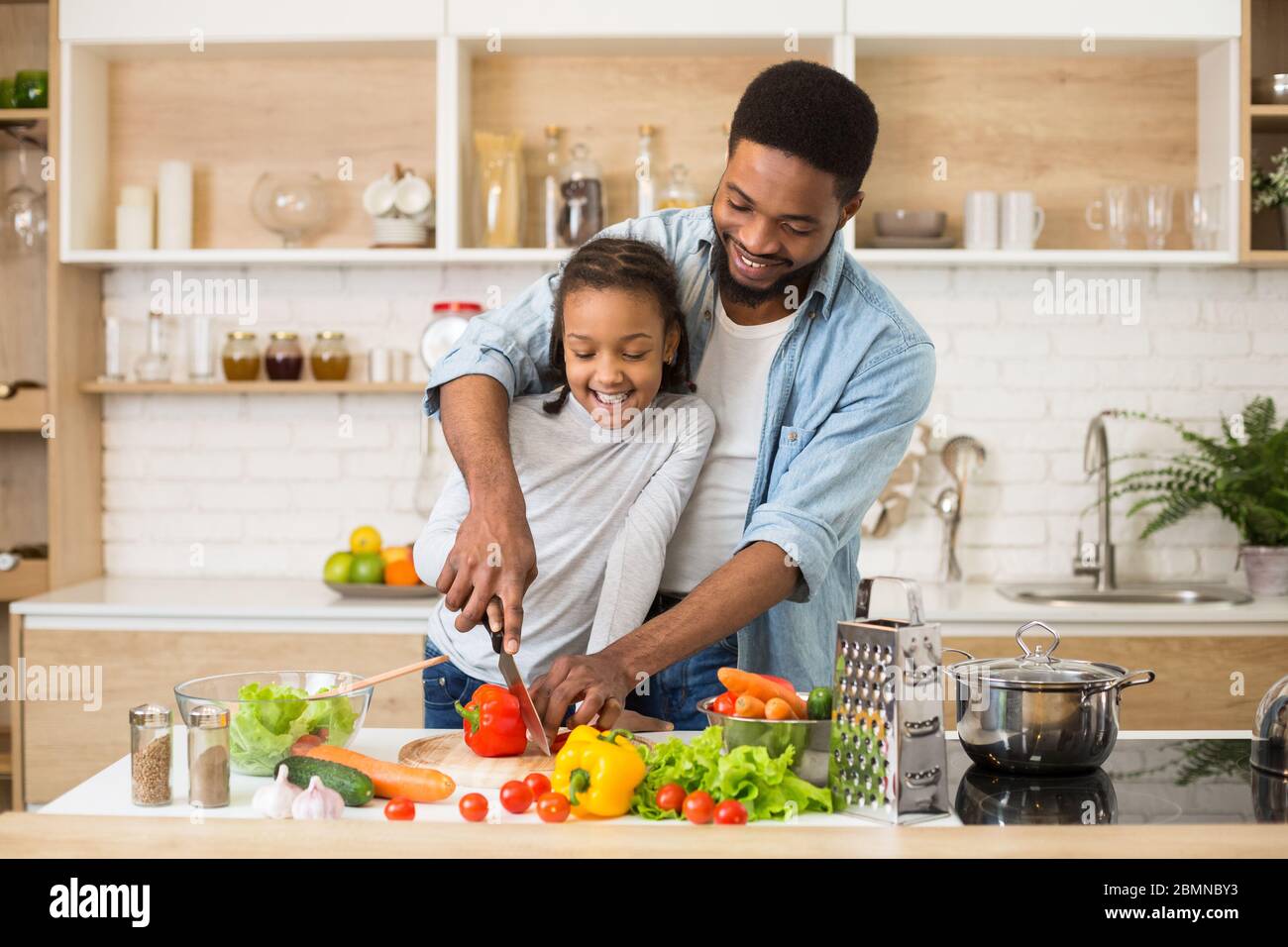 Vegan family cooking healthy food together at home Stock Photo - Alamy