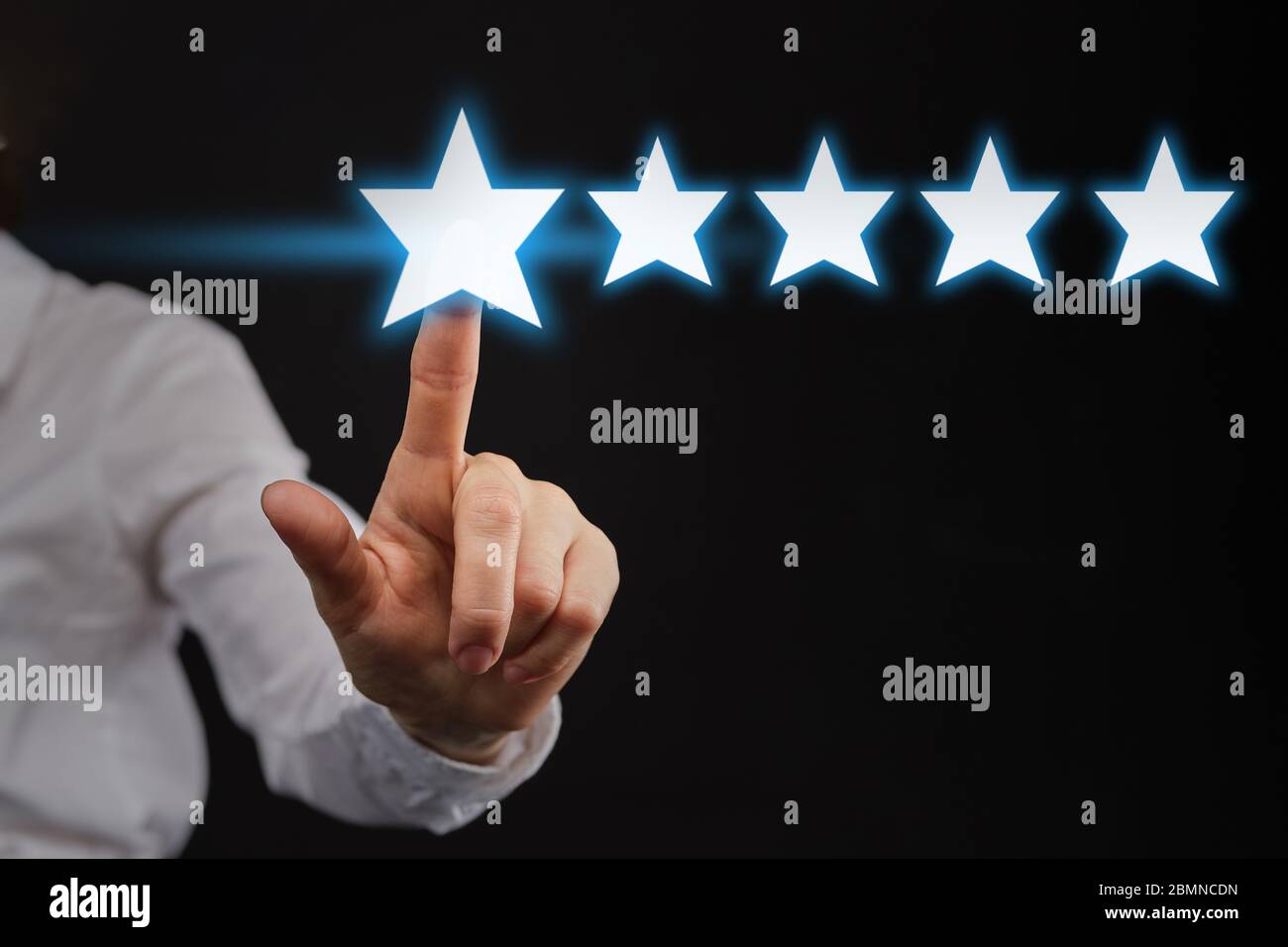 The hand points to five 5 stars as a concept of top rating or rating ...
