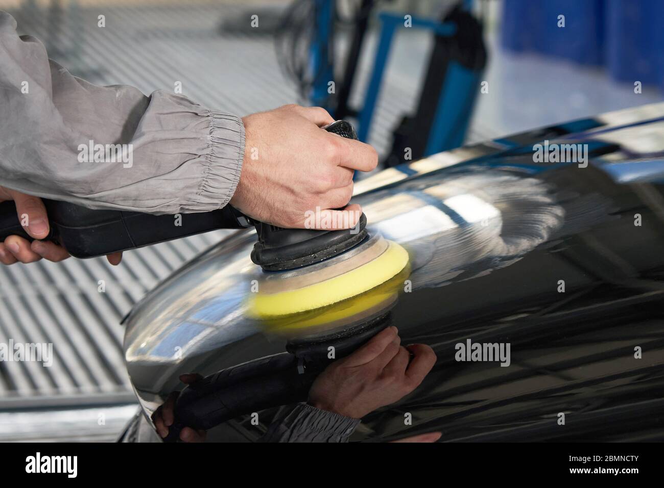 hands holding polisher to polish car in auto workshop Stock Photo - Alamy