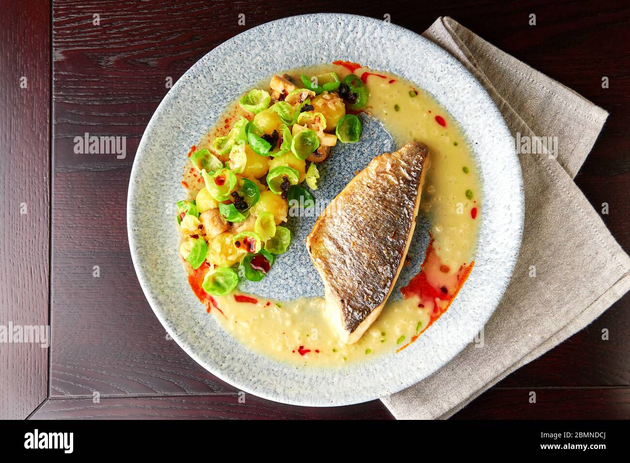 Tasty grilled sea bass fillet served with steamed brussel sprouts ...