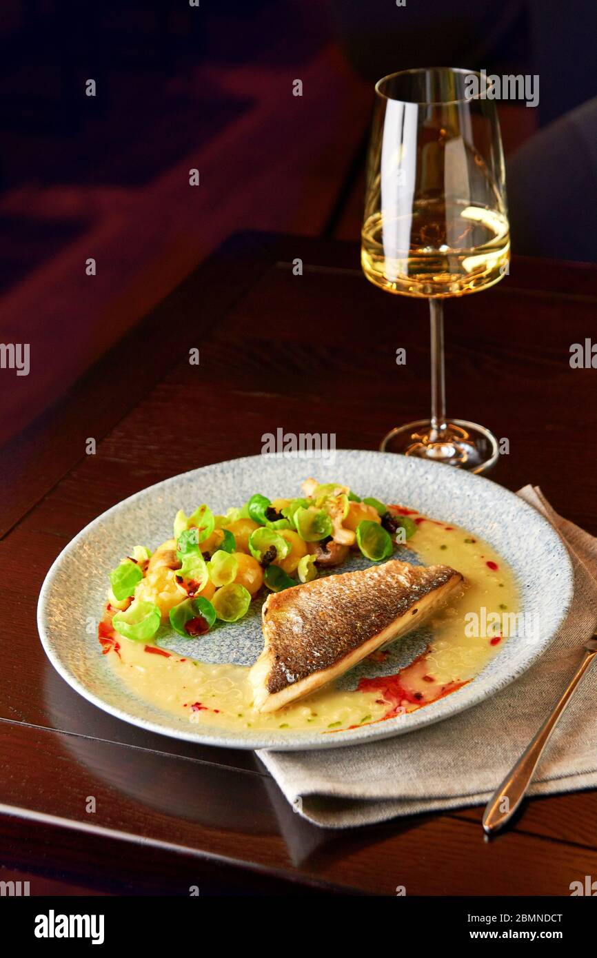 Tasty grilled sea bass fillet served with steamed brussel sprouts ...