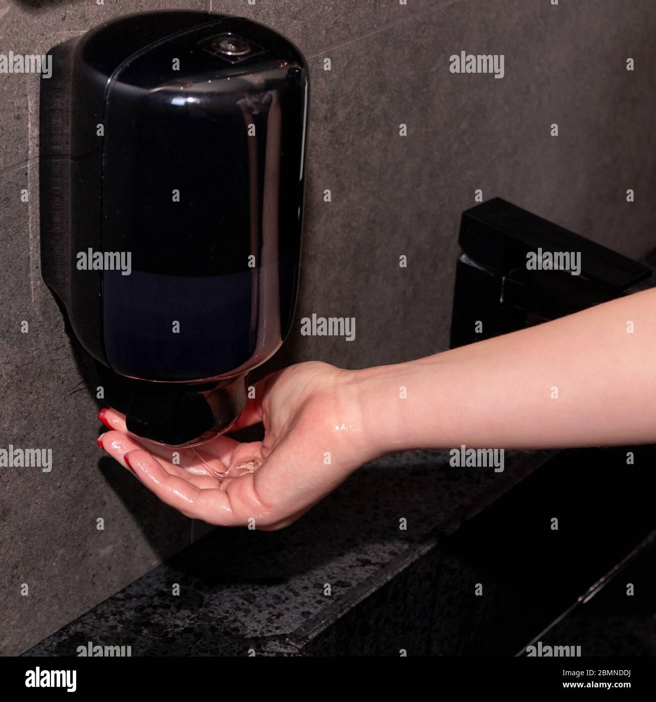 Woman washing hands, applying liquid soap. Hygiene to stop spreading ...