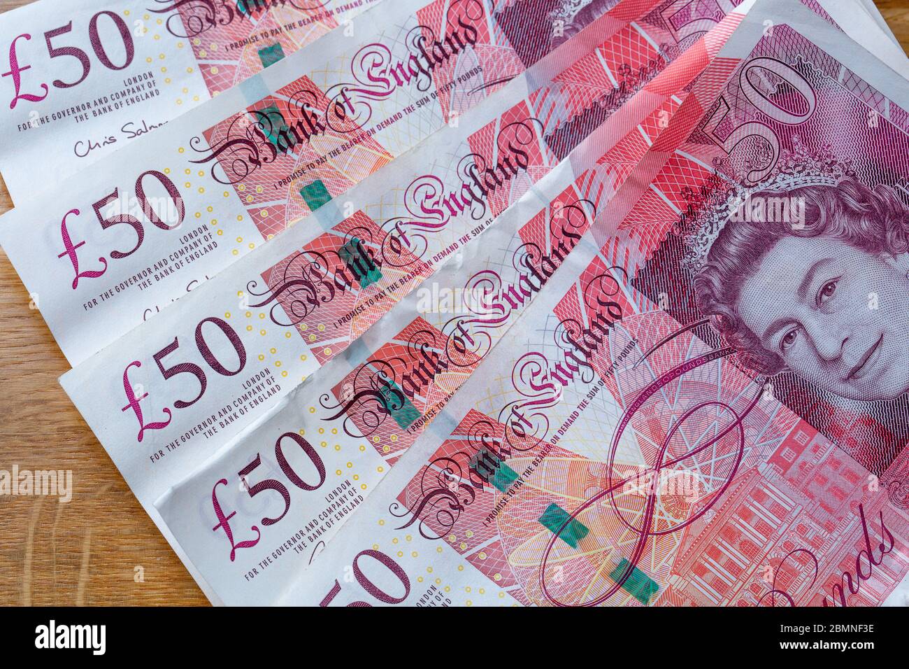 Fifty pound notes, £50 sterling banknotes Stock Photo - Alamy