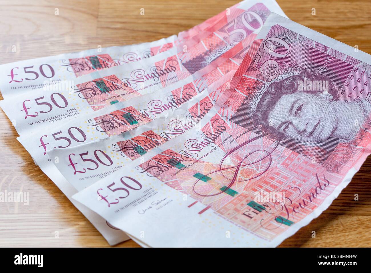 Fifty pound notes, £50 sterling banknotes Stock Photo - Alamy