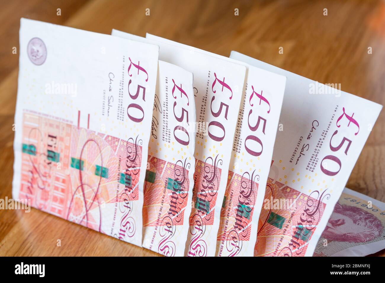 Fifty pound notes stacked up, £50 notes pound sterling Stock Photo - Alamy