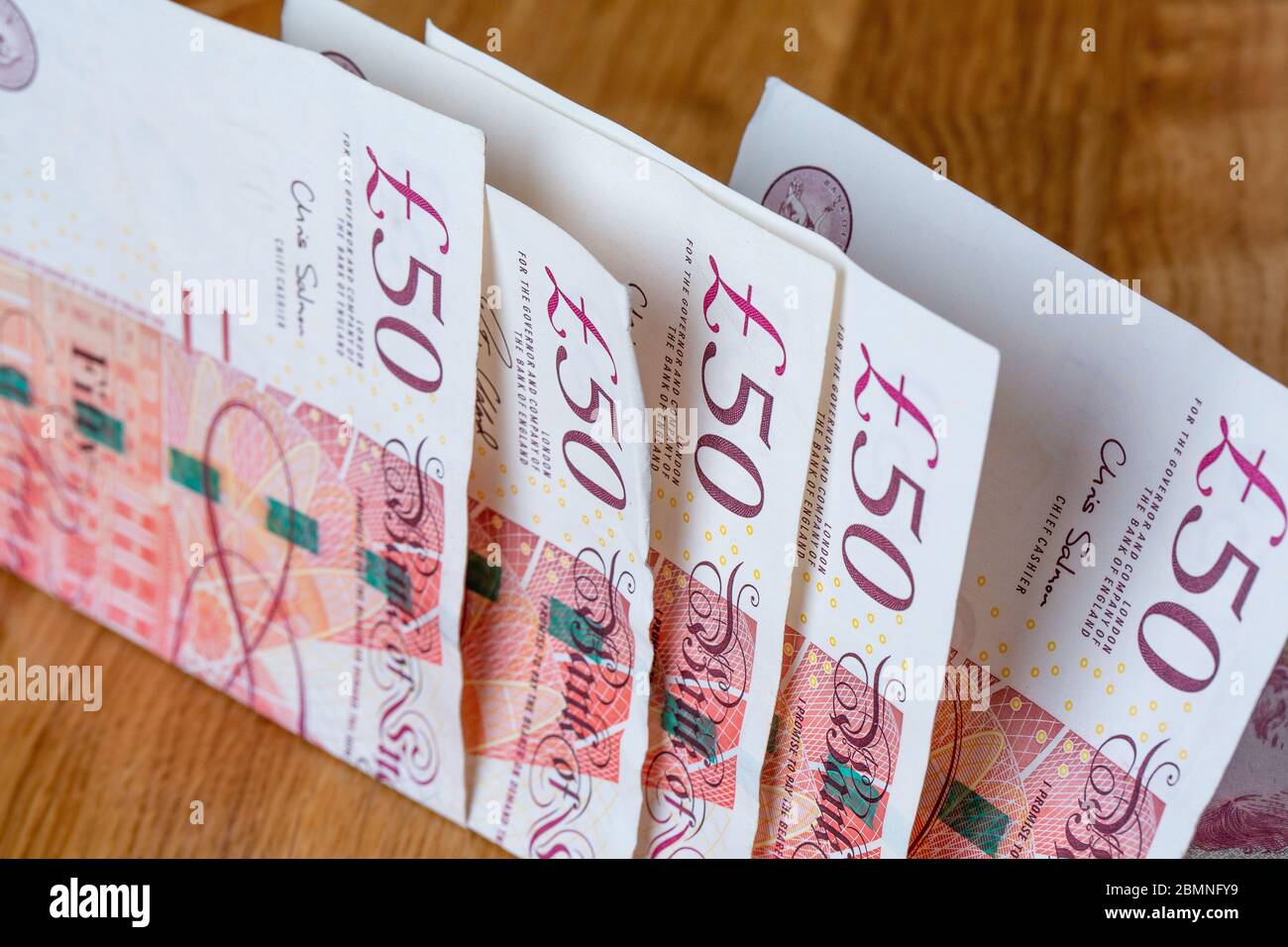 Fifty pound notes stacked up, £50 notes pound sterling Stock Photo - Alamy