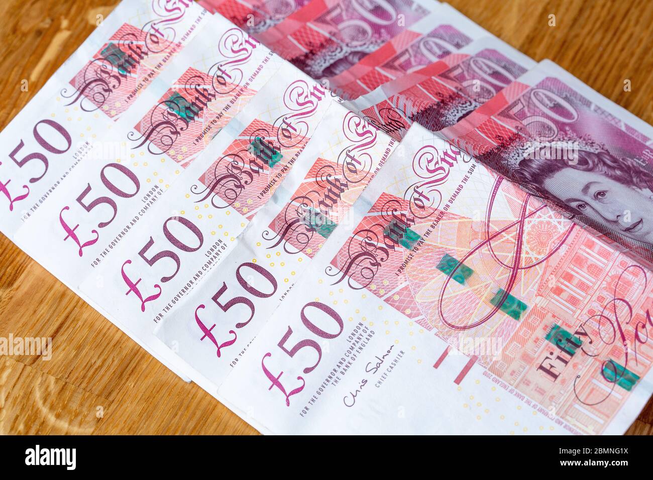 Fifty pound notes stacked up, £50 notes pound sterling Stock Photo - Alamy