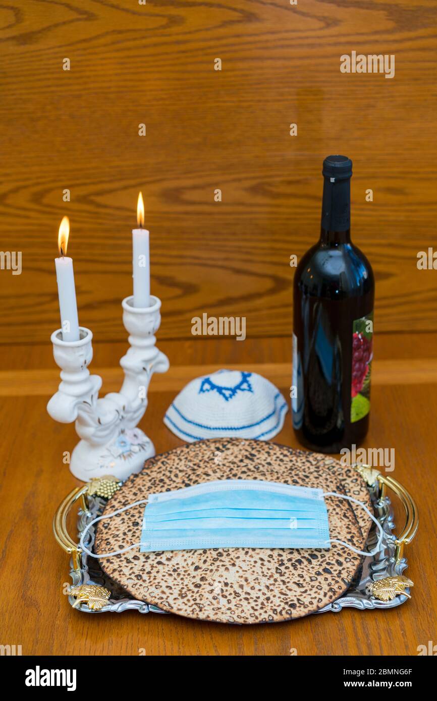Corona Passover. Dust mask, bottle of wine and matzah - a traditional ...